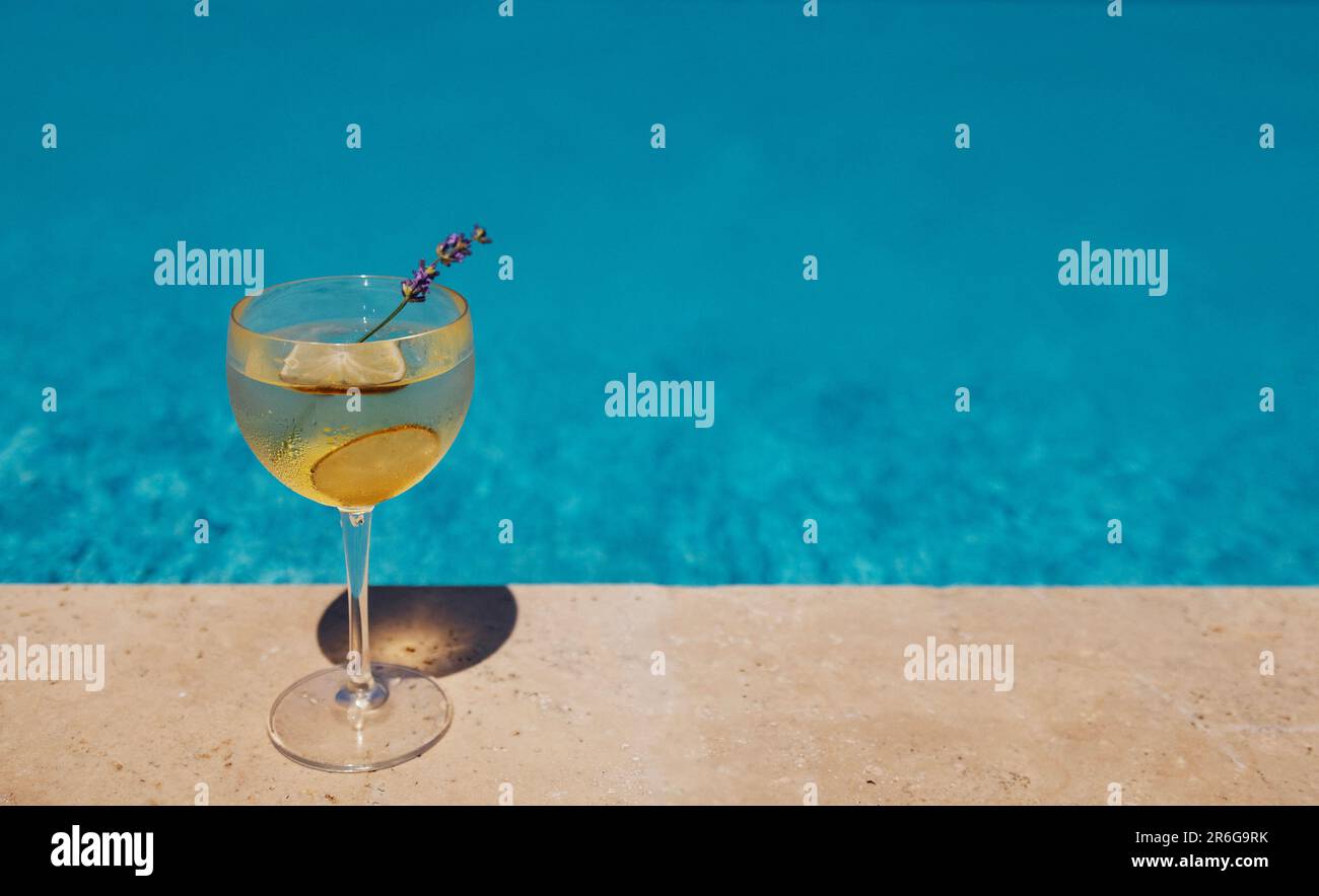 Two glass of delicious cocktail against poolside at resort hotel ...