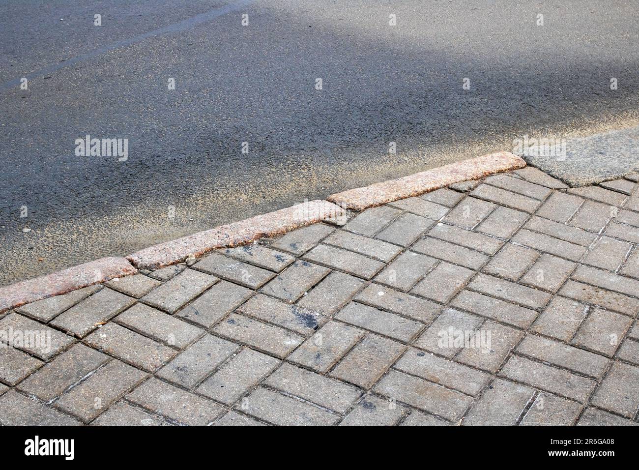 Paving slabs and curbs by the road close up Stock Photo - Alamy