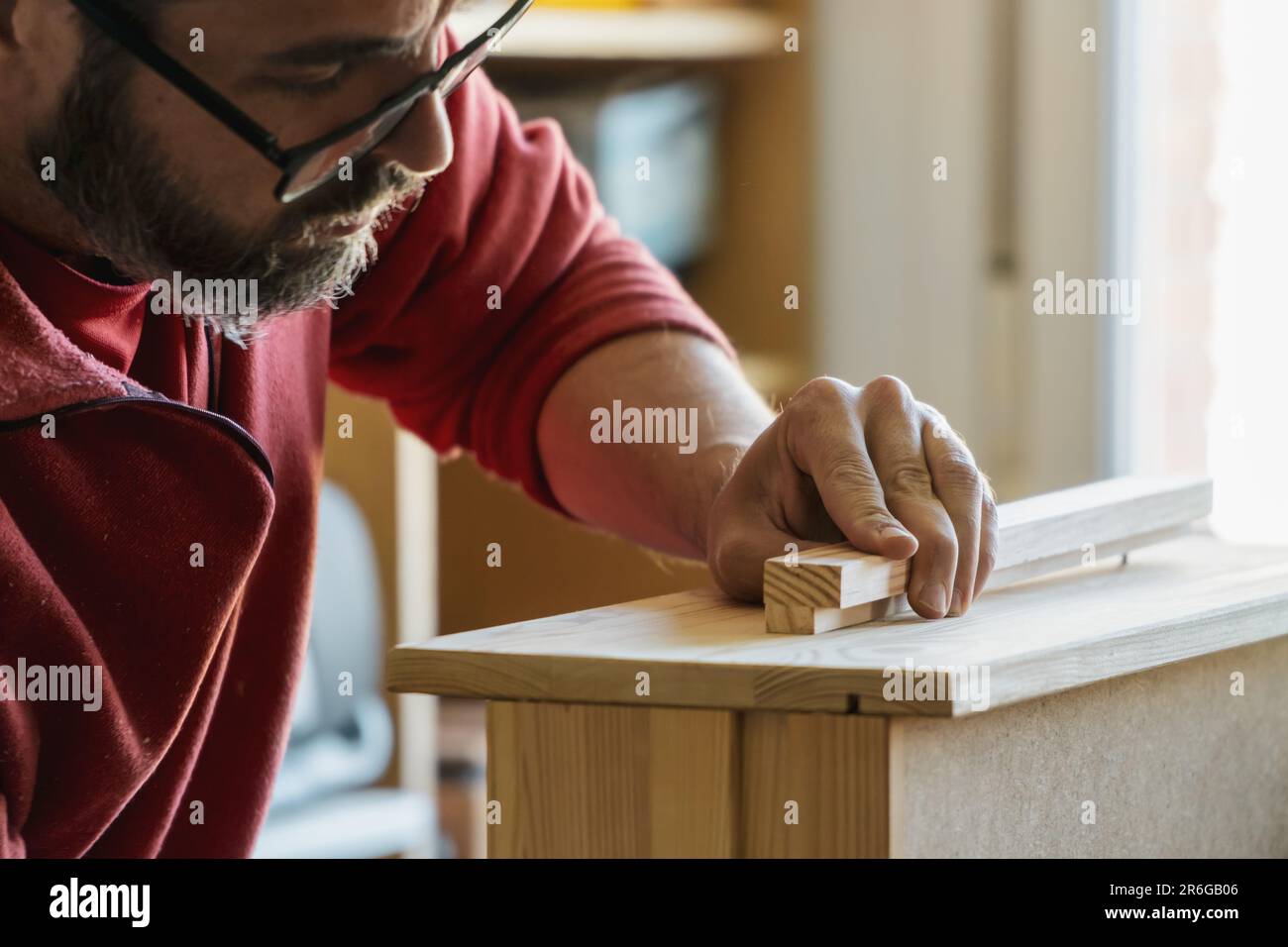 closeup of a carpenter's hand assembling timber Stock Photo - Alamy