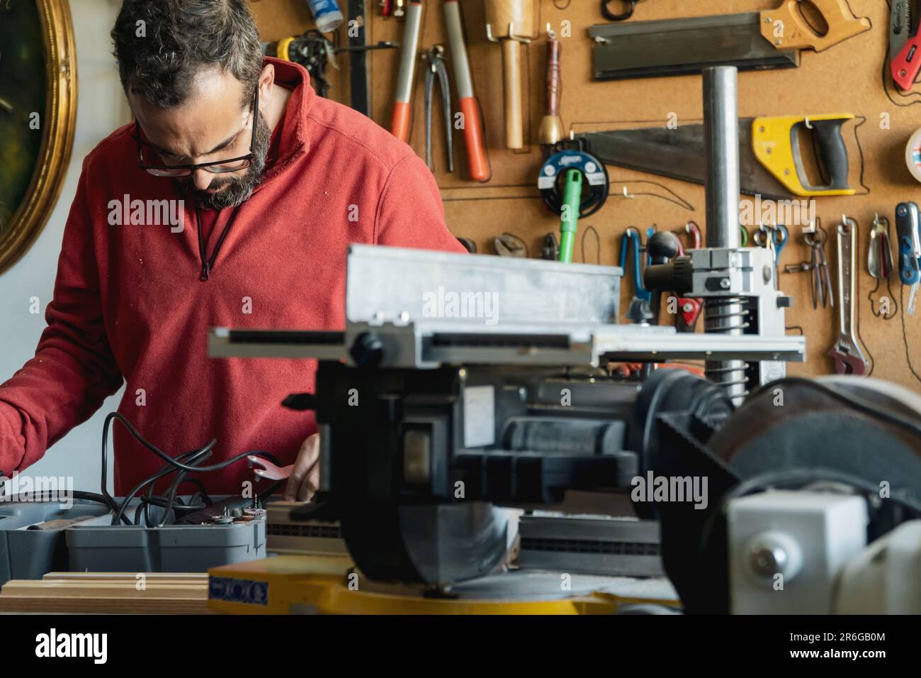 Carpenter working with power and hand tools Stock Photo - Alamy