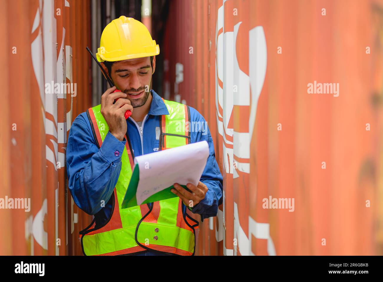 Industrial engineer worker working at overseas shipping container yard ...