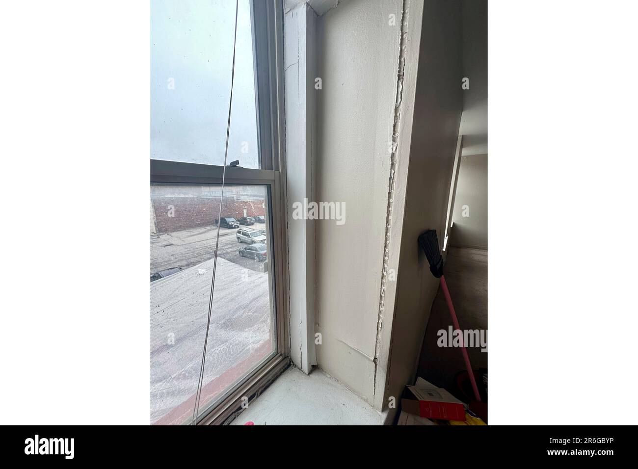 Cracks run along the window sill in an apartment rented by Shauna Dixon ...
