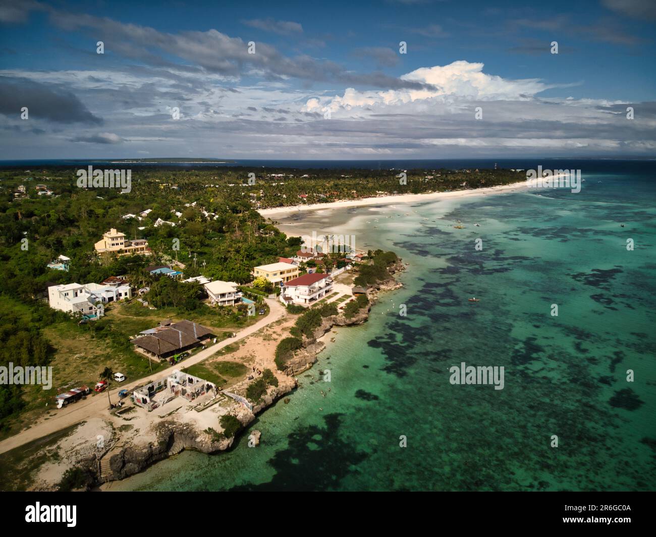 An idyllic tropical resort situated on the shoreline of a beautiful and ...