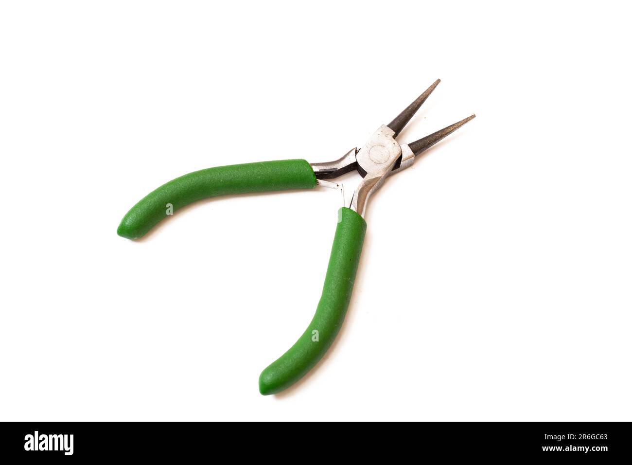 green pliers isolated on white background close up Stock Photo - Alamy