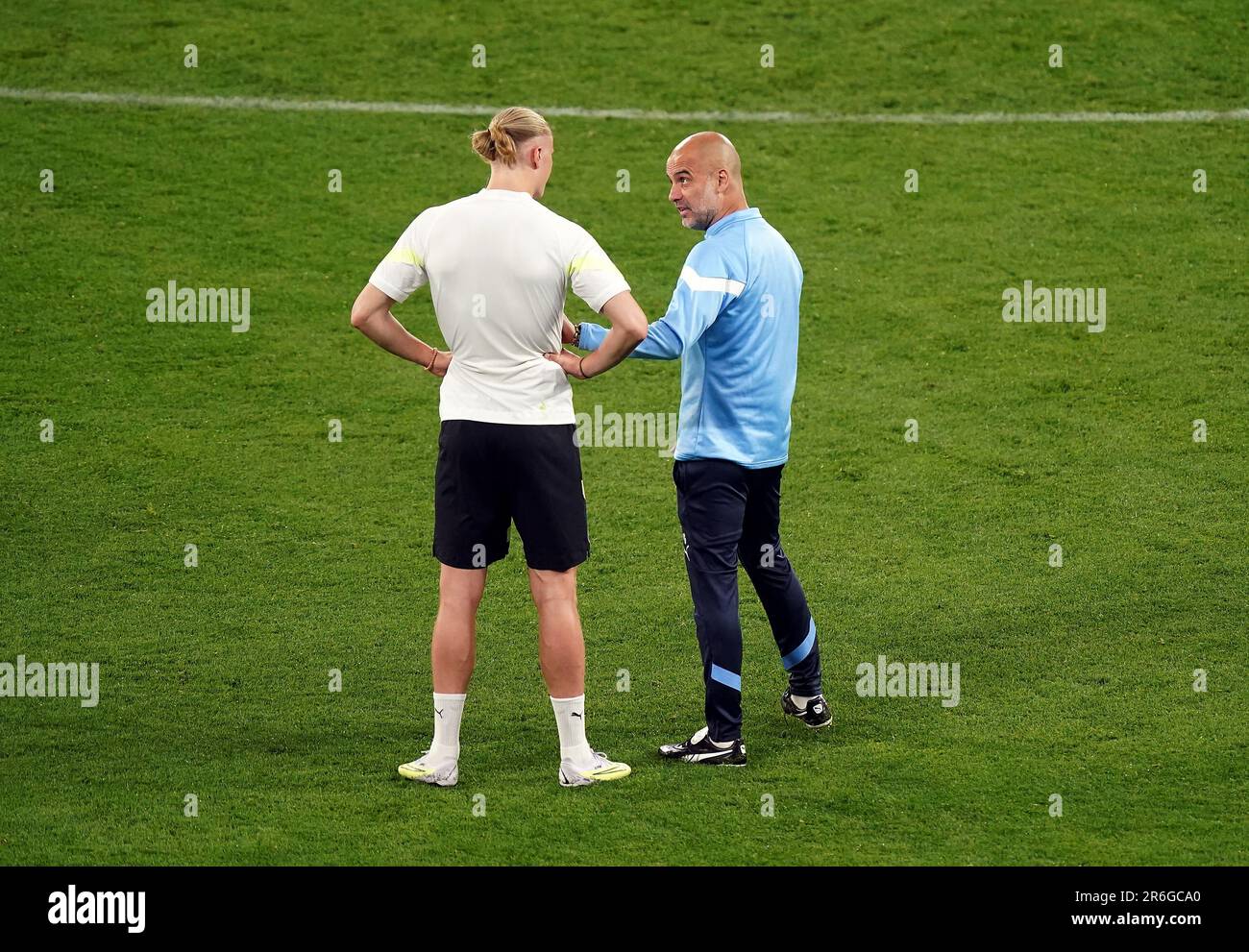 Manchester City manager Pep Guardiola and Erling Haaland during a training session at the ...