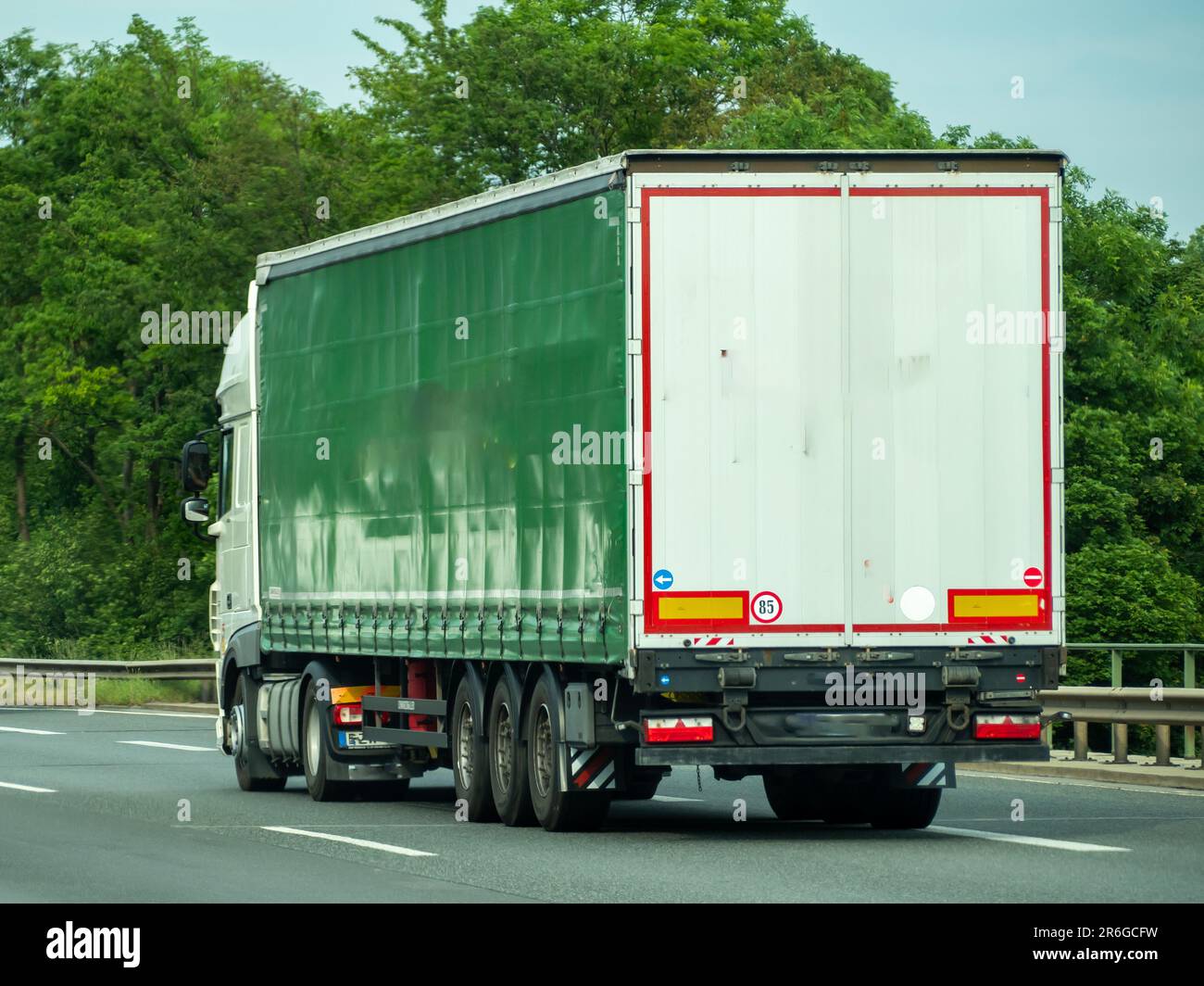 Trucks on the European highway. Transportation of goods Stock Photo - Alamy