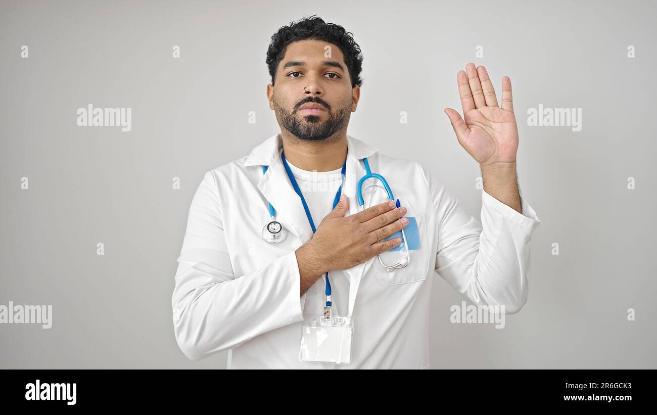 African american man doctor making an oath with hand on chest over ...
