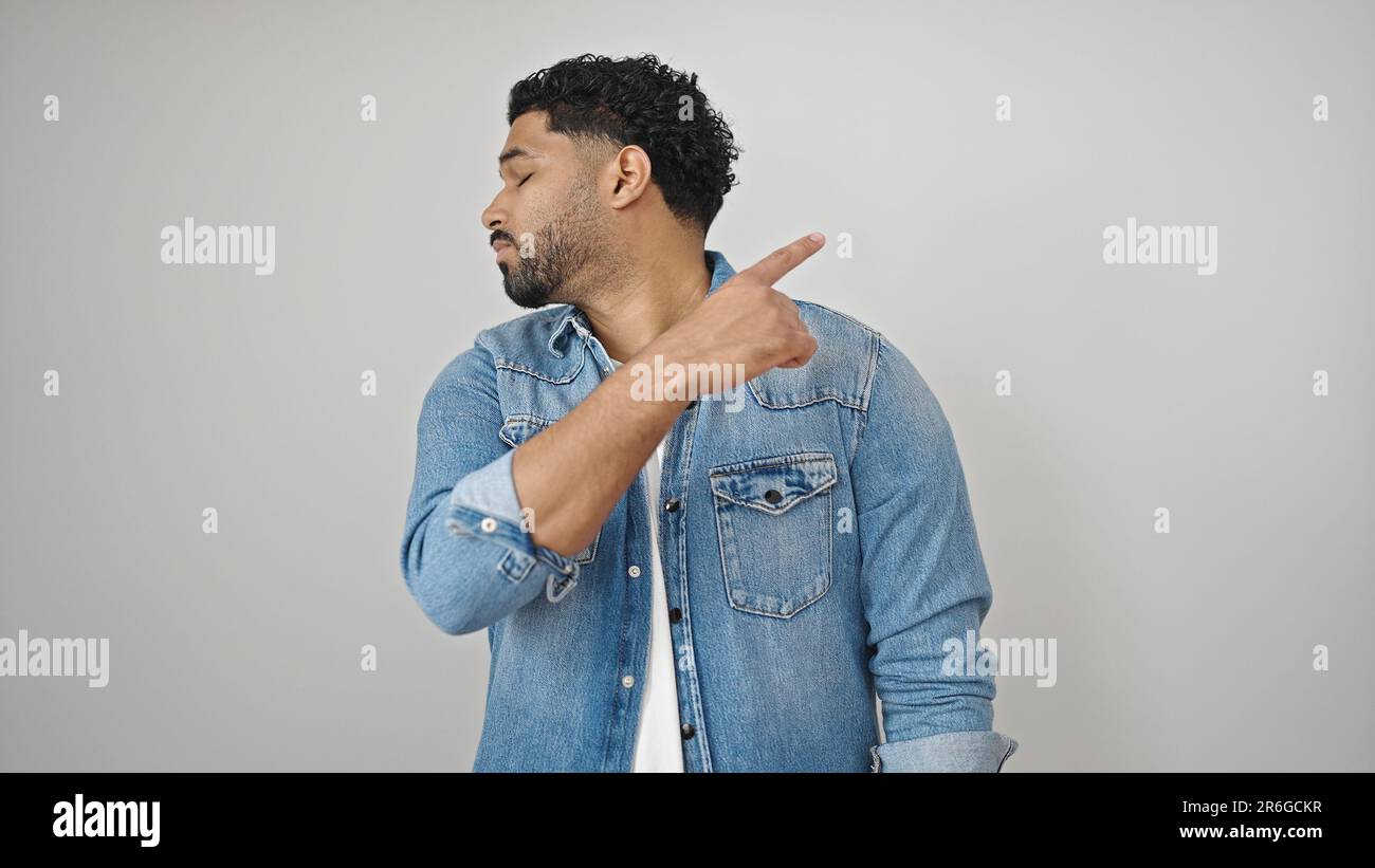 African american man pointing to blank space with angry face over ...