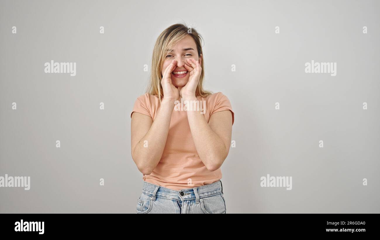 Young blonde woman screaming over isolated white background Stock Photo ...