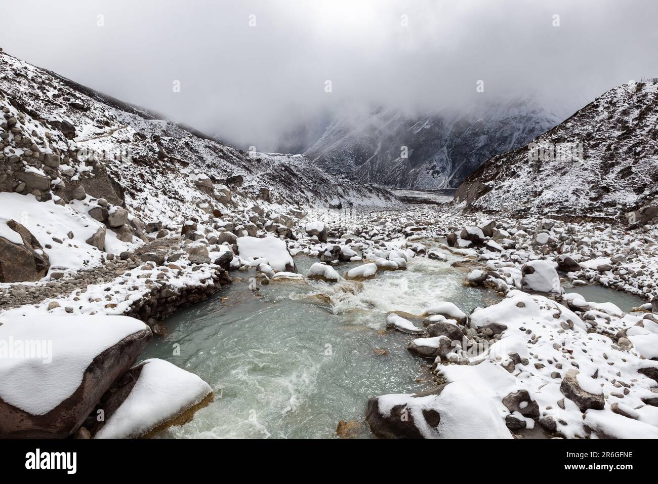 River in snowy valley in Himalayas. Everest Base Camp Trek. Himalayan ...