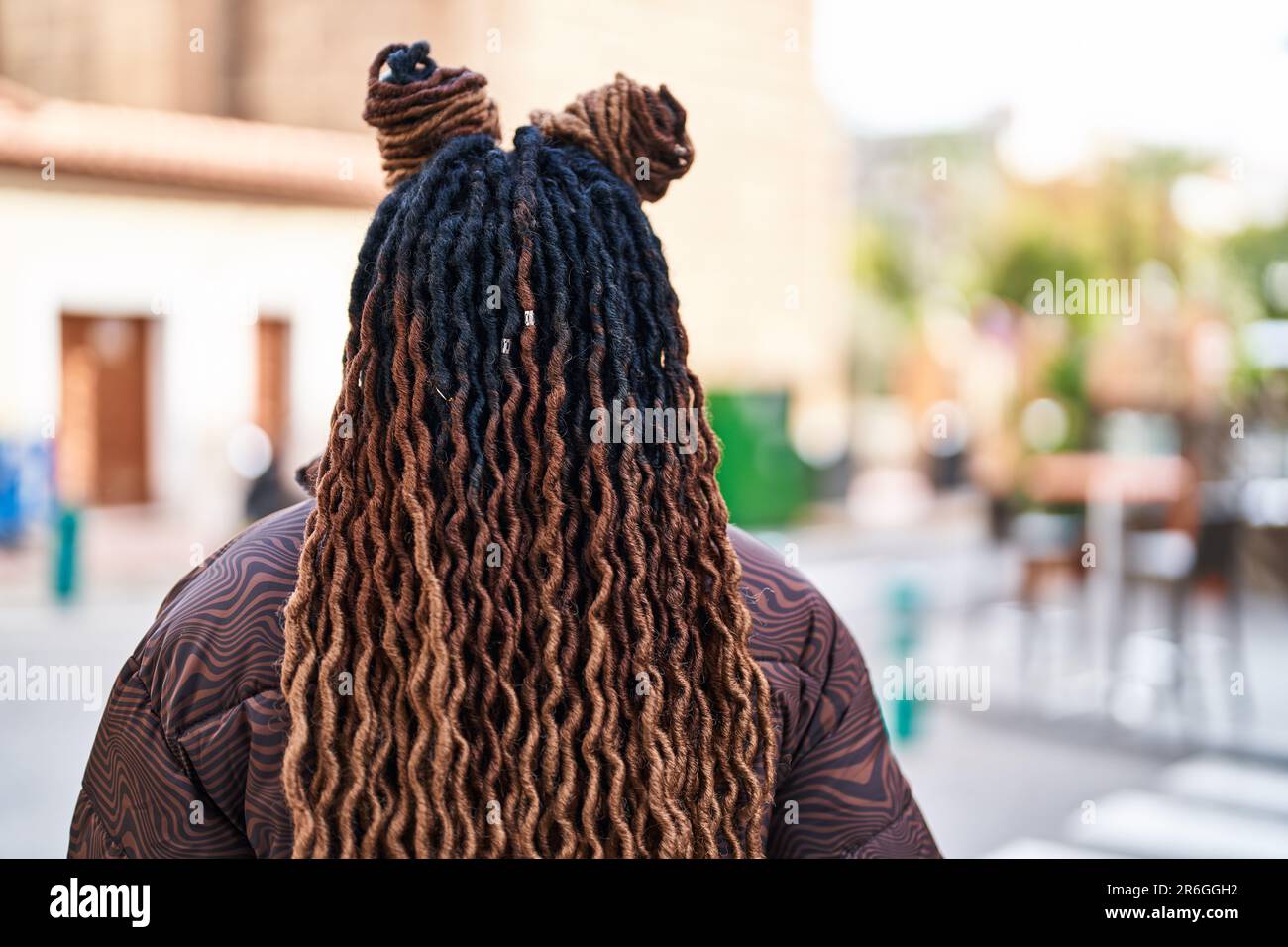 African american woman standing on back view at street Stock Photo - Alamy