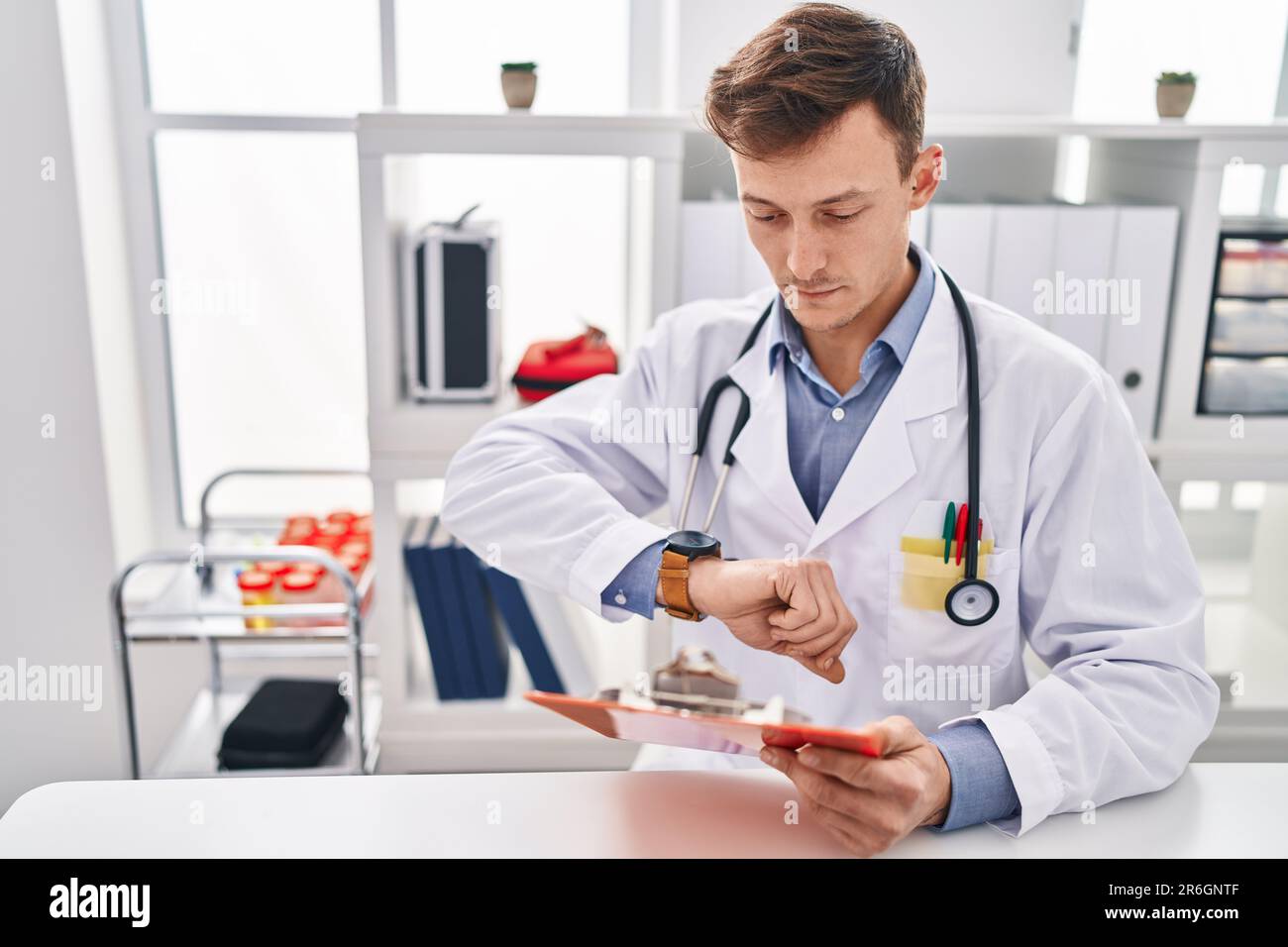 Adult looking watch sitting hospital hi-res stock photography and ...