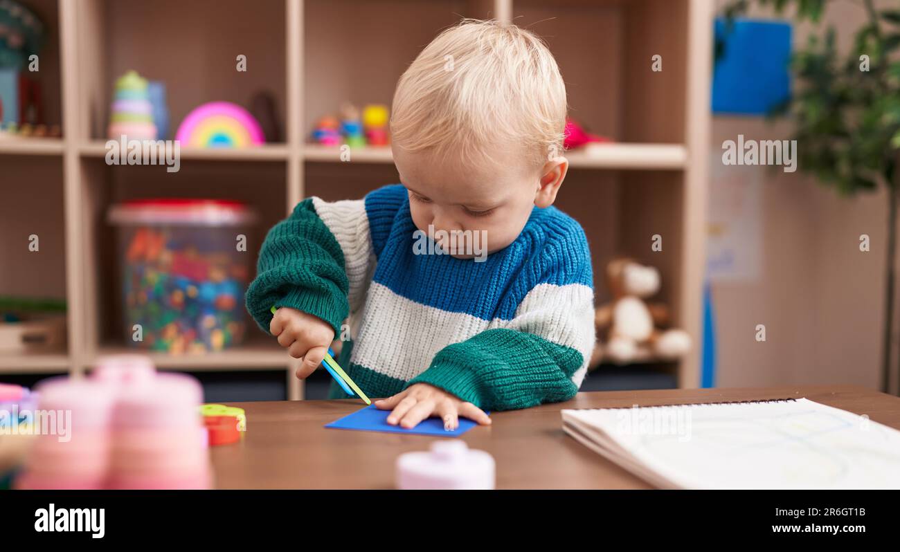 Boy cutting drawing scissors hi-res stock photography and images - Alamy