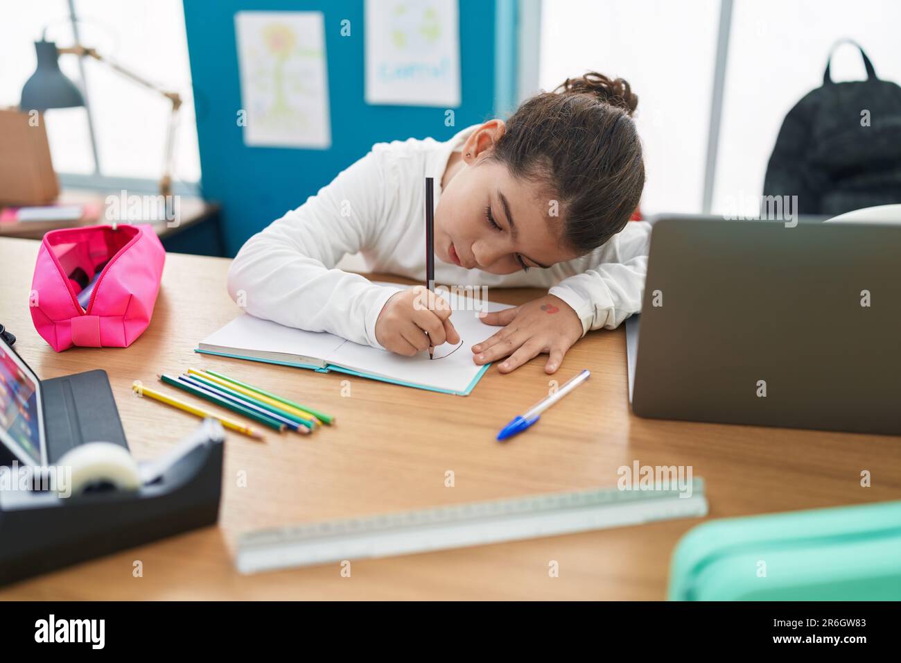 Girl hispanic writing paper school hi-res stock photography and images ...