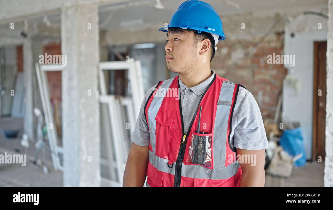 builder standing with serious expression at construction site Stock ...