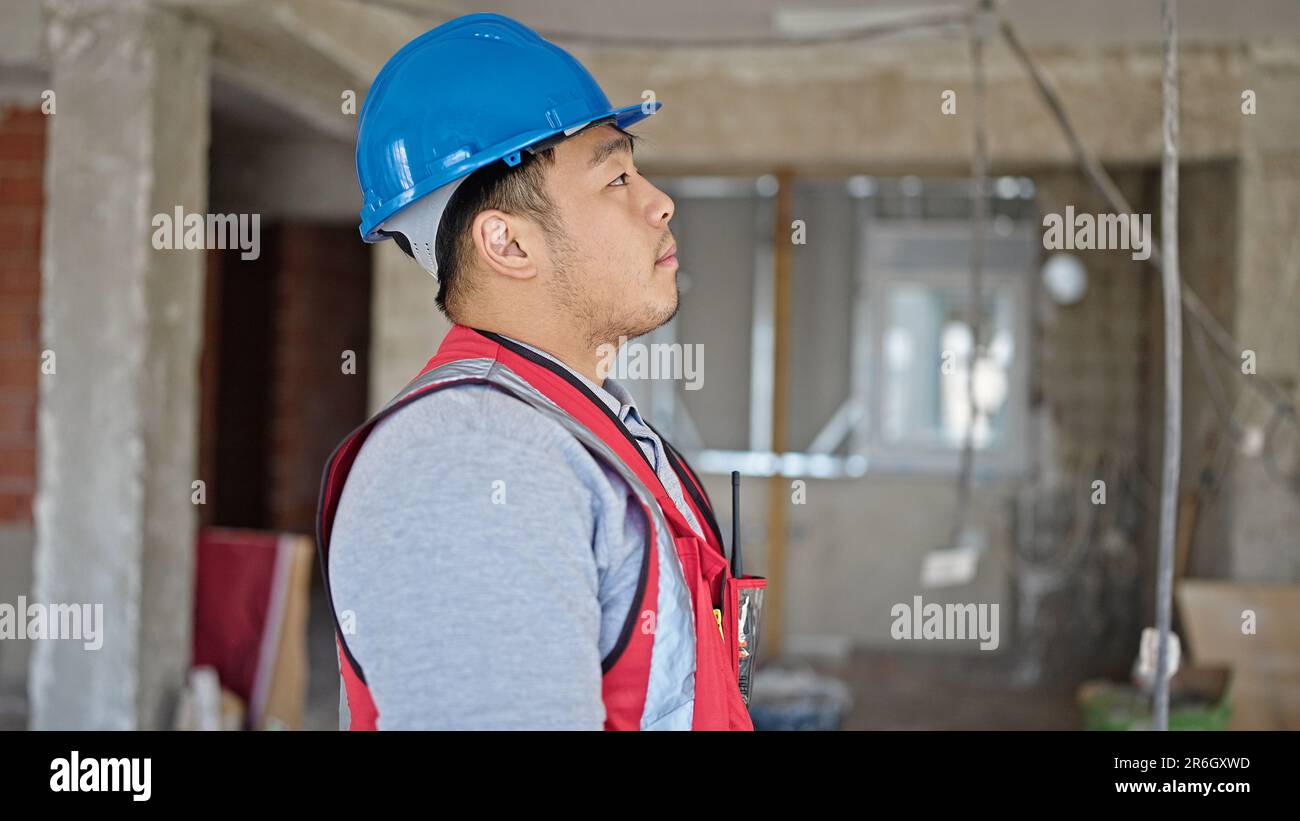 builder standing with serious expression at construction site Stock ...