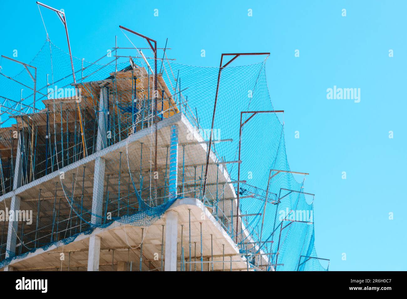 New building with safety net on construction site over blue sky ...