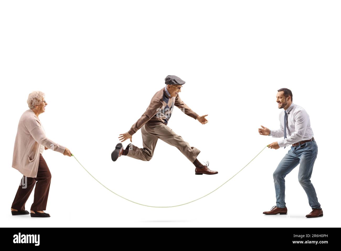 Elderly mother and son holding a rope and senior man skipping isolated ...