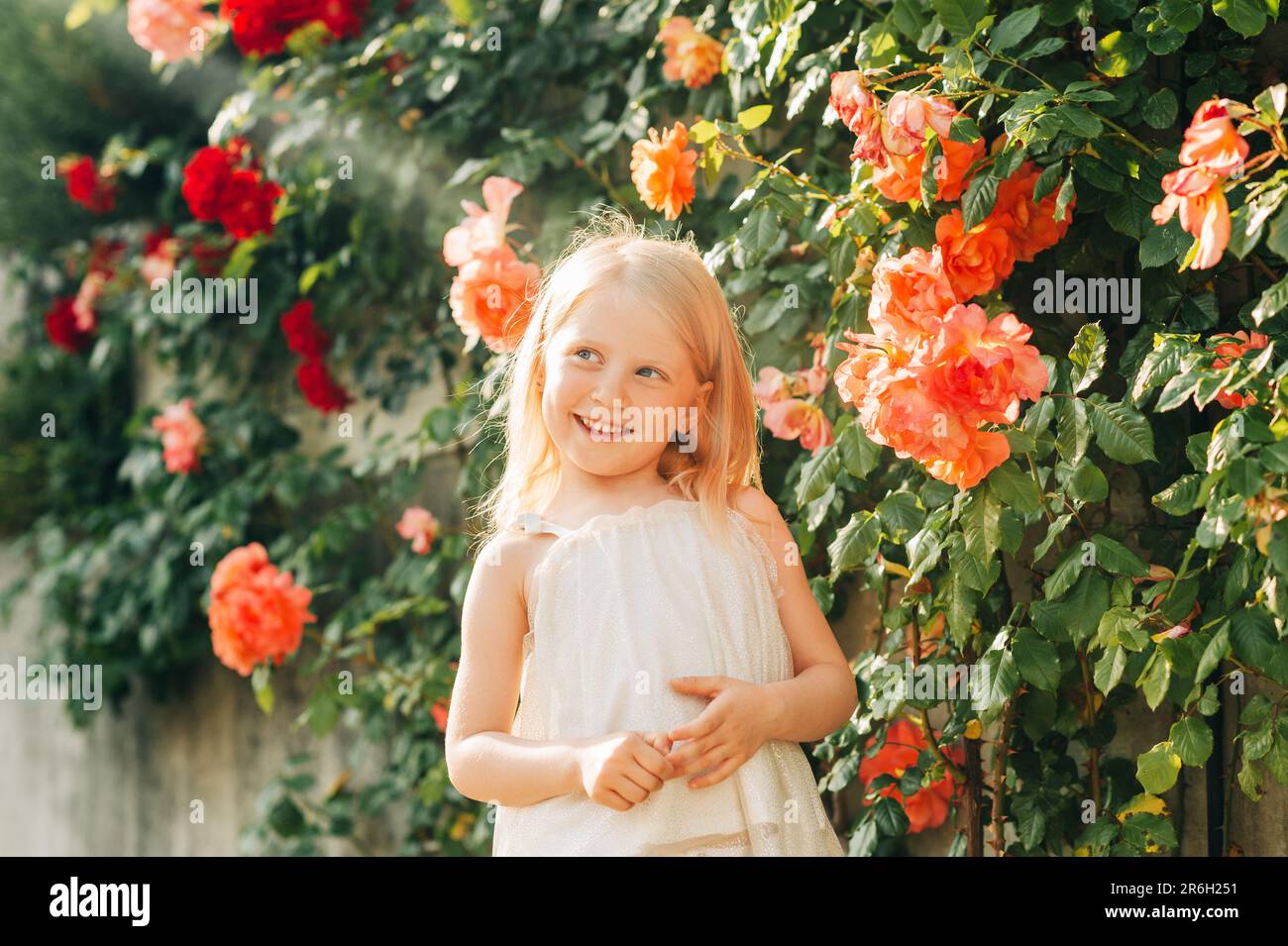 Outdoor summer portrait of adorable 5 year old little girl playing in ...