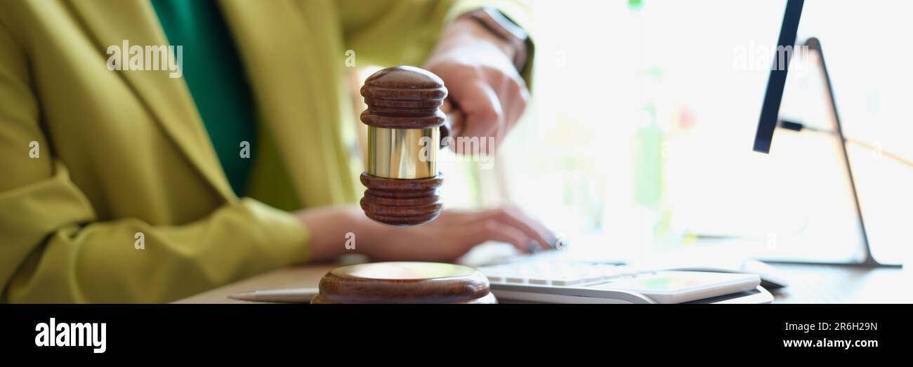 Female hand striking gavel in court room Stock Photo - Alamy