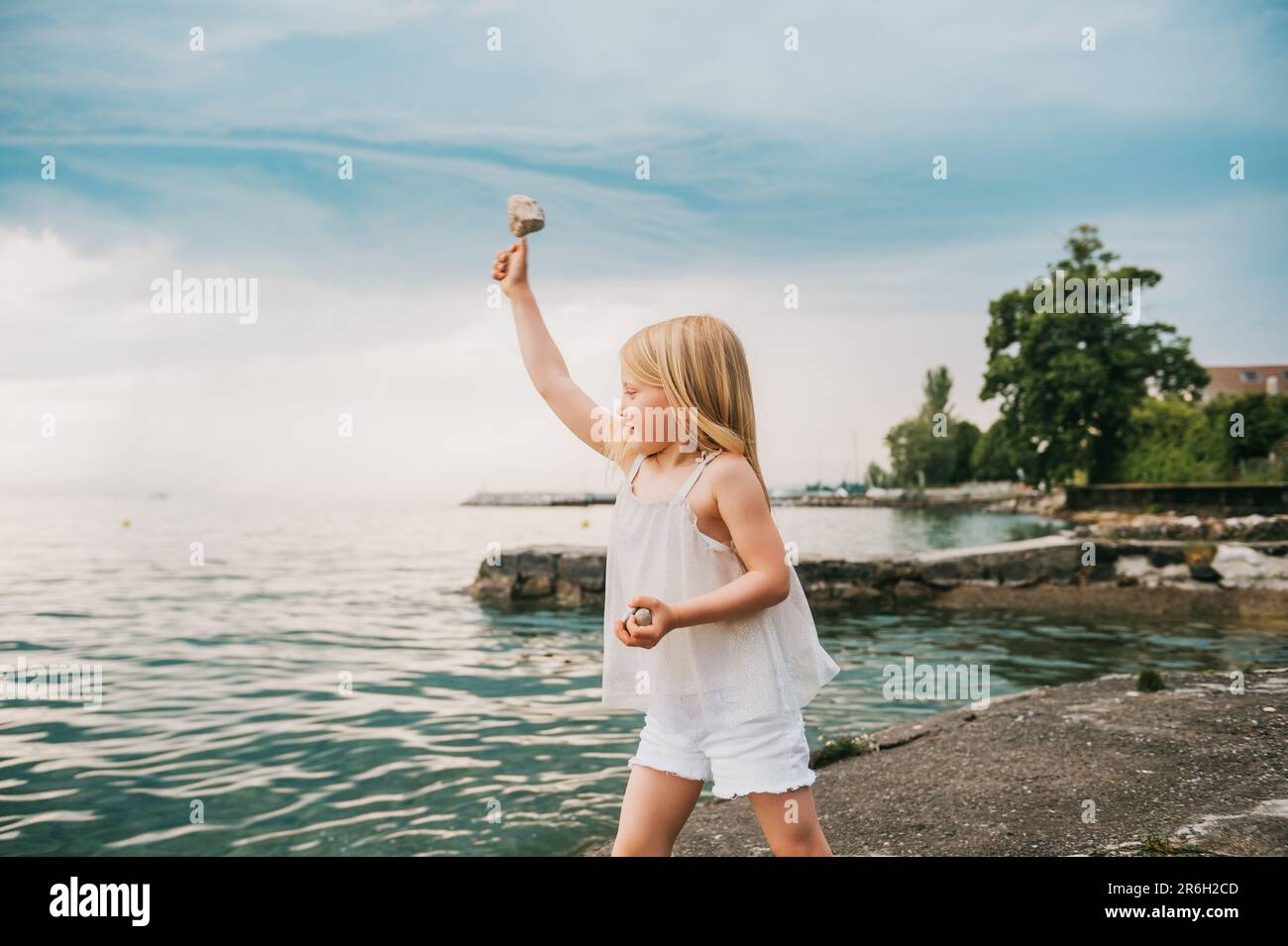 Girl throwing stones hi-res stock photography and images - Alamy