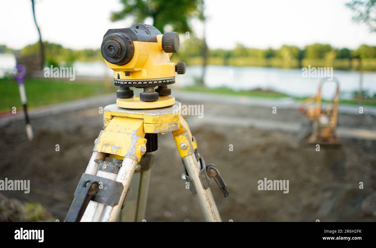 Surveyor equipment theodolite on the construction site. Land surveying ...