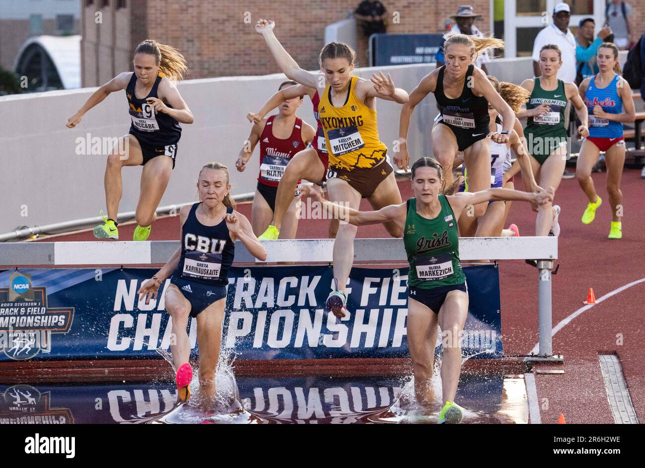 Action at the water jump of the women's 3,000 meter steeplechase semi ...