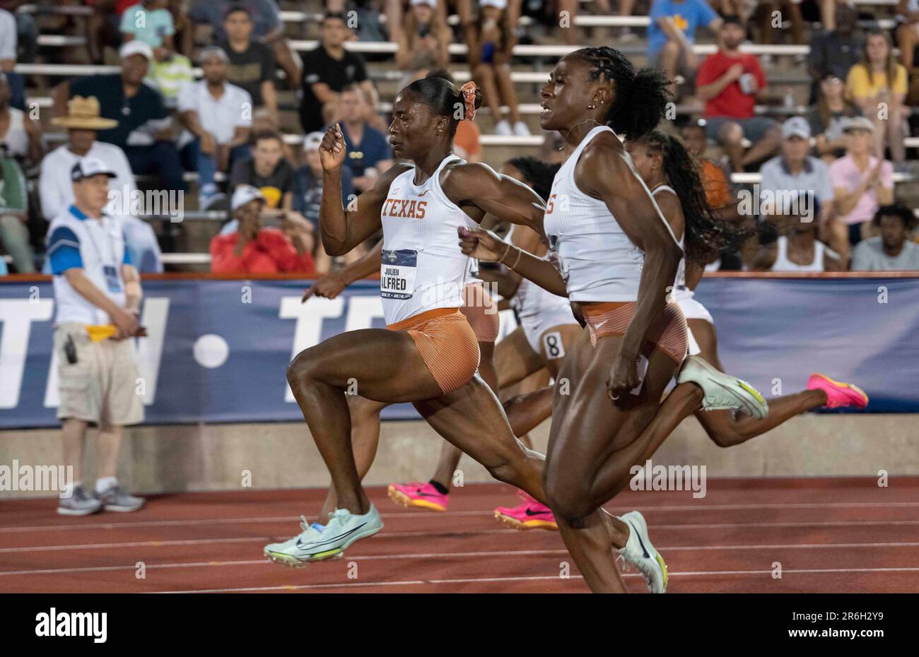 Texas sprinters race to the finish line in the first heat of the women ...
