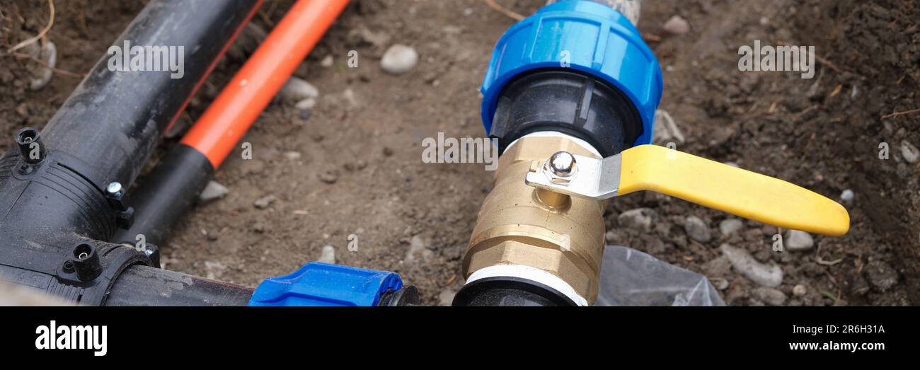 Underground irrigation system with elbow fitting of pvc pipes at bend ...