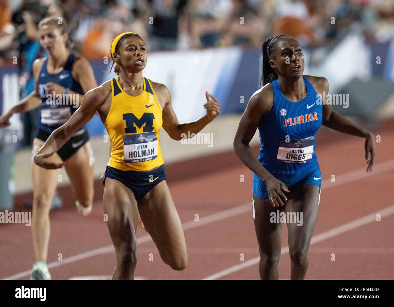 ZIYAN HOLMAN of Michigan (l) and TALITHA DIGGS of Florida at the finish ...