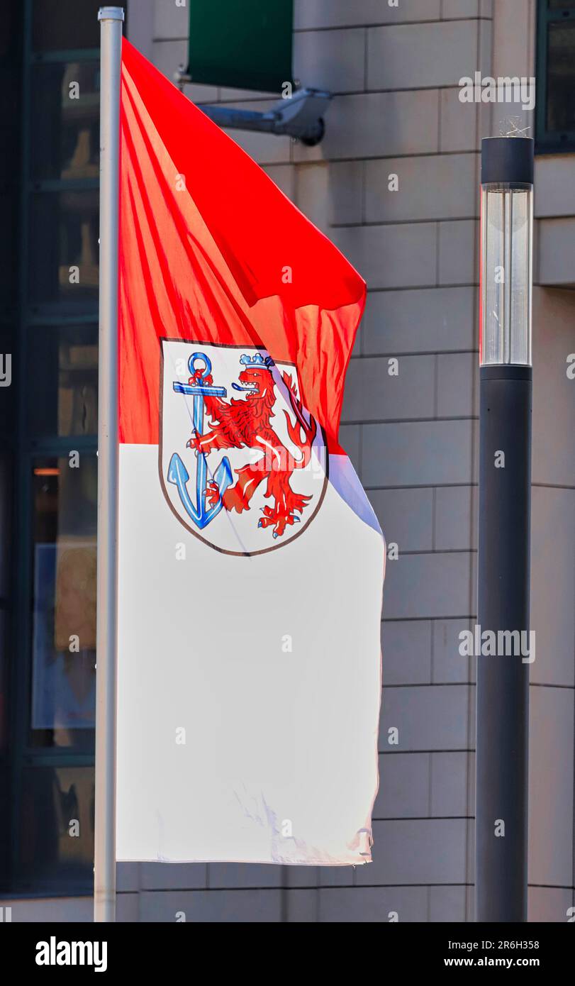 A vertical shot of the Duesseldorf municipal code of arms on a flag ...