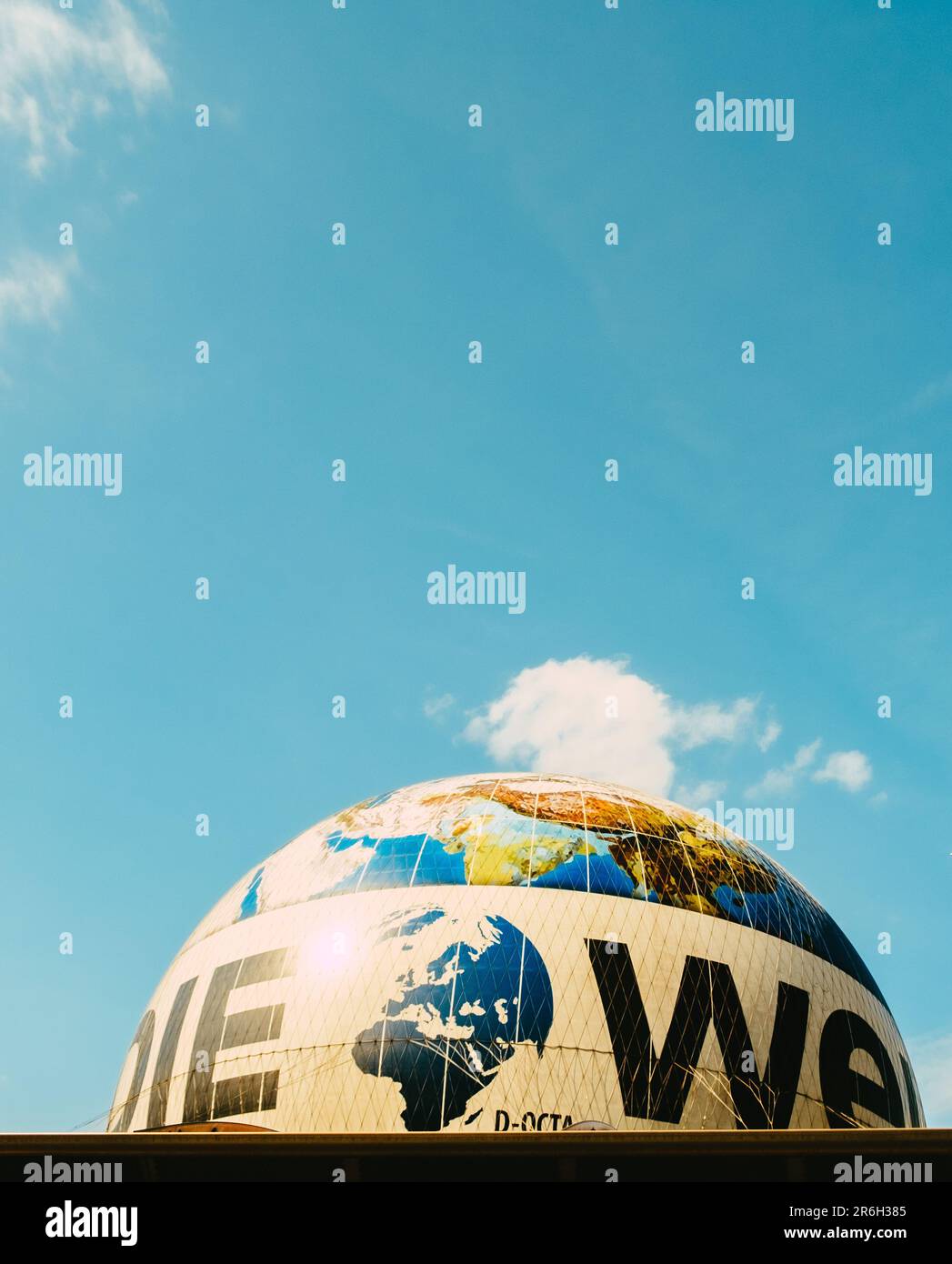 An Earthlike spherical object situated on a blue sky background Stock ...