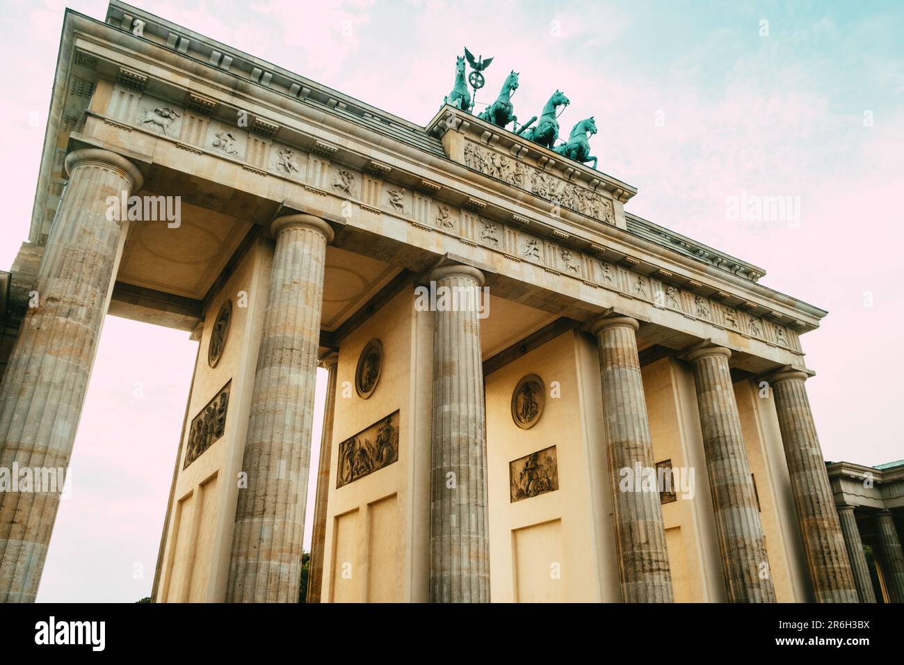 An architectural structure featuring statues atop its grand height ...