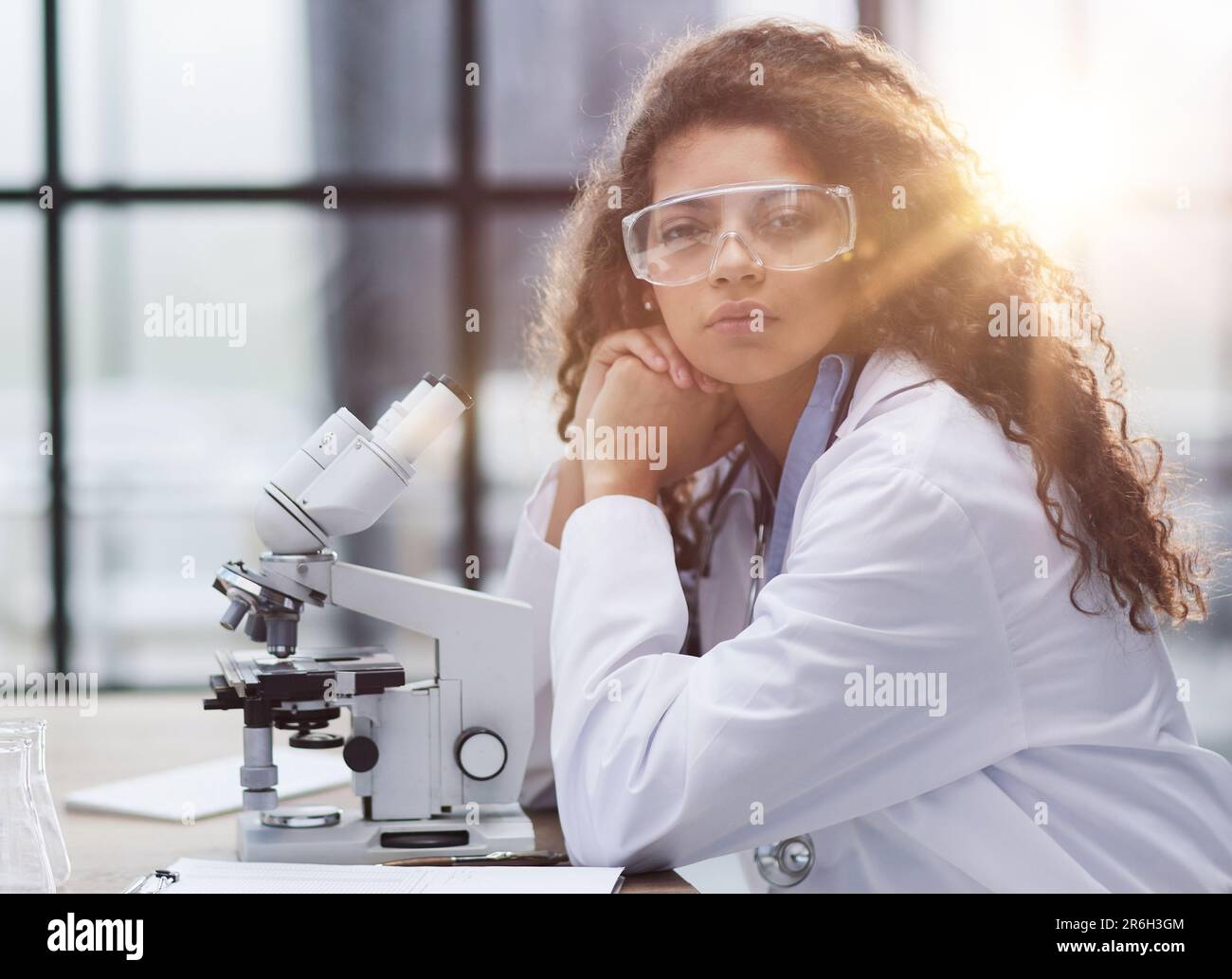 Young woman in biological laboratory. Attractive young female scientis ...