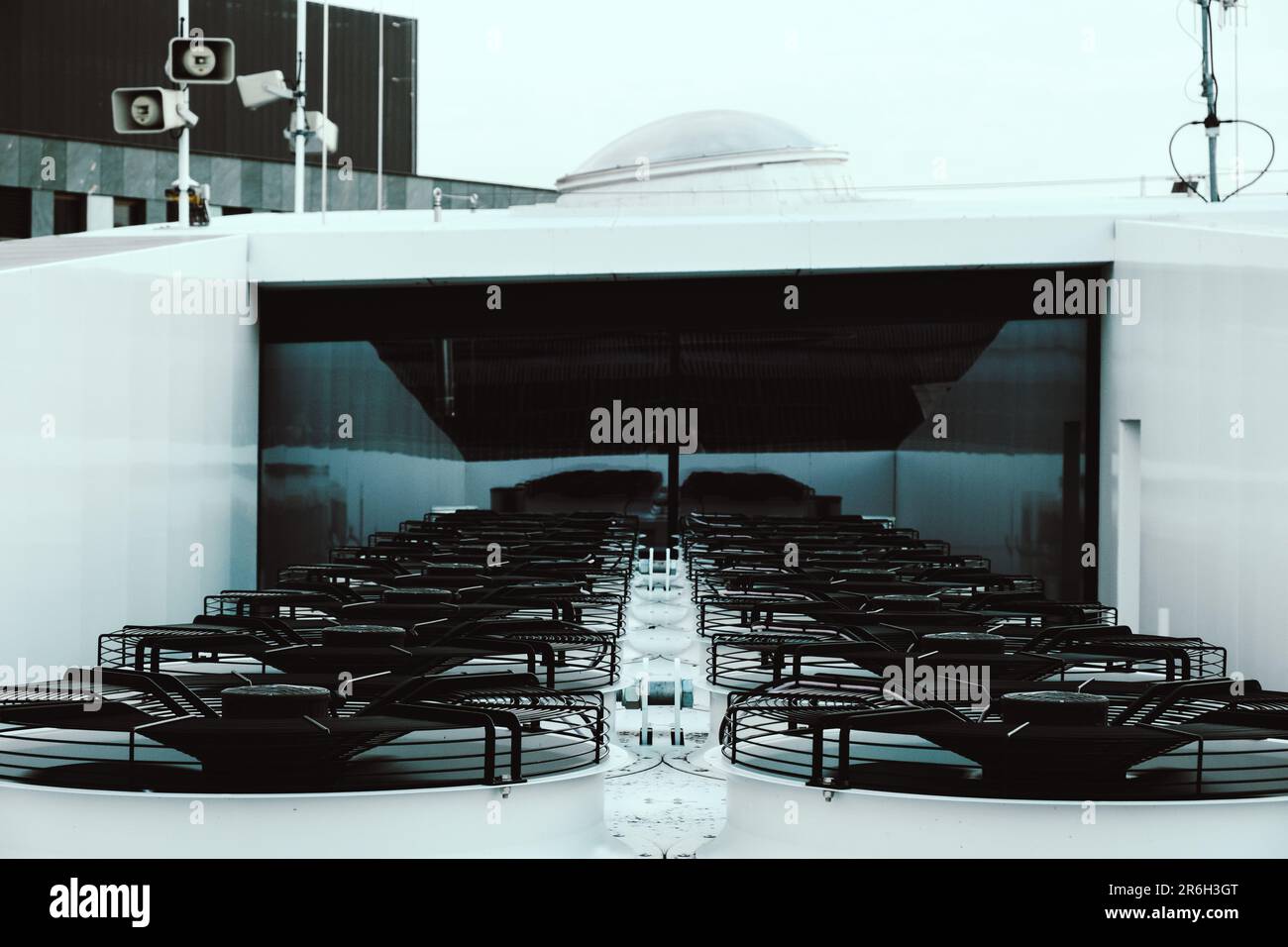 An areal shot of a concert hall with a stage and seating empty of ...