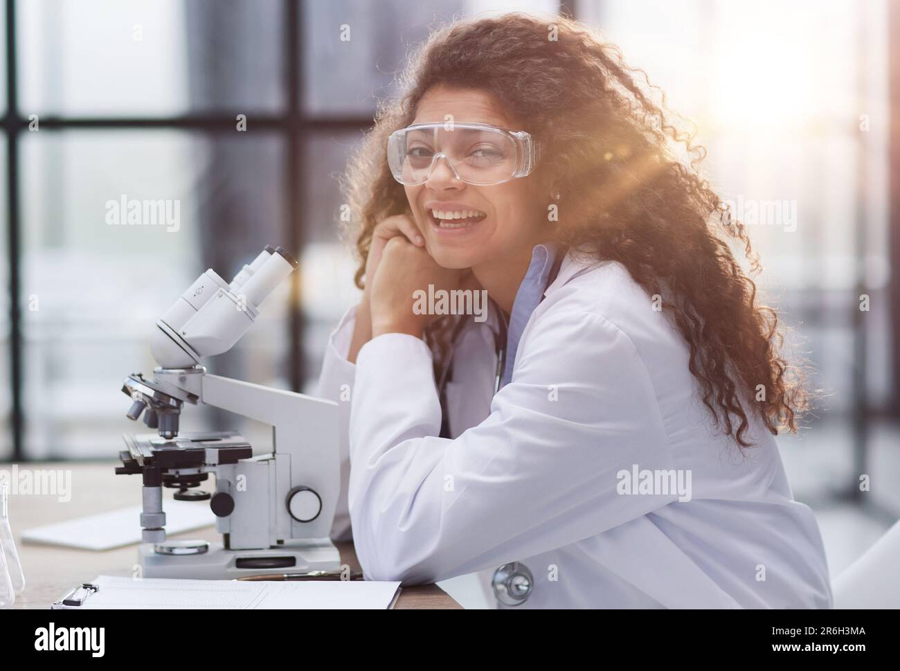 Young woman in biological laboratory. Attractive young female scientis ...