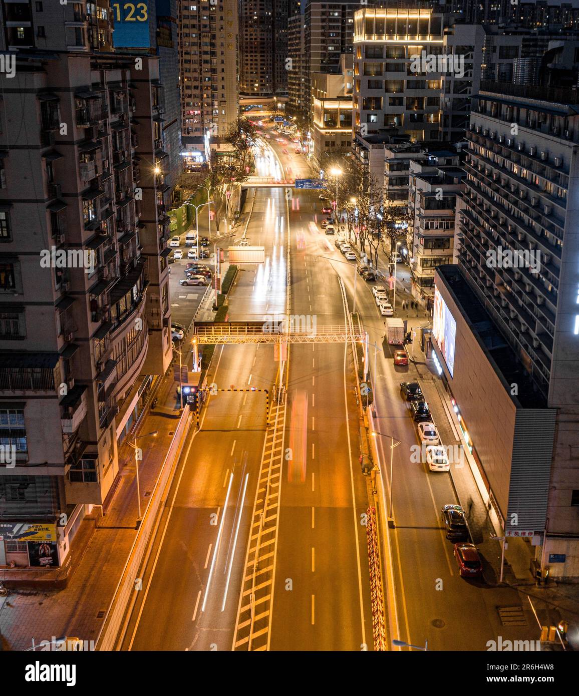 An aerial photo of a winding road leads to a large metropolitan ...