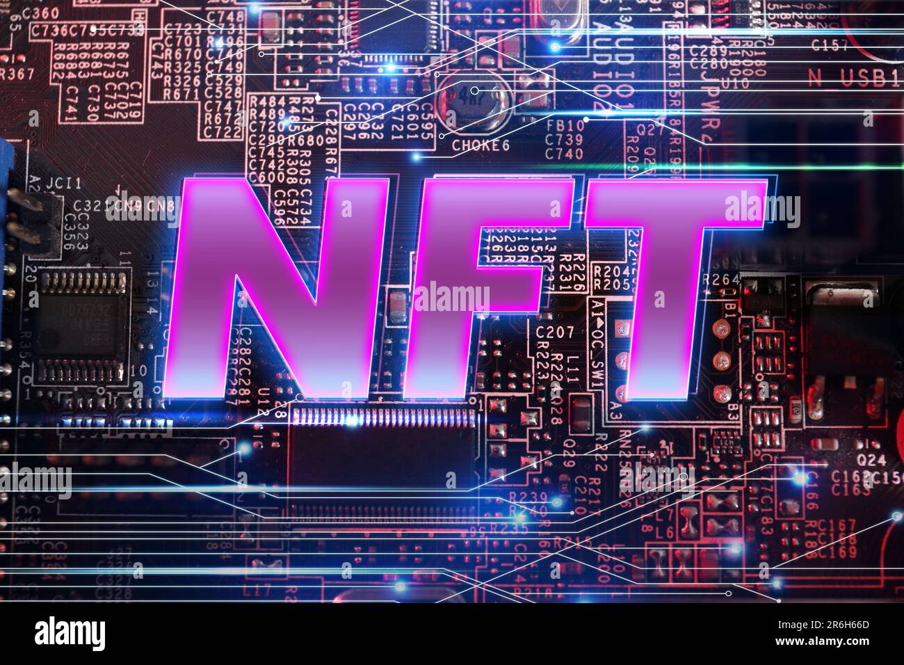 Abbreviation NFT (non-fungible token) on computer motherboard, top view ...