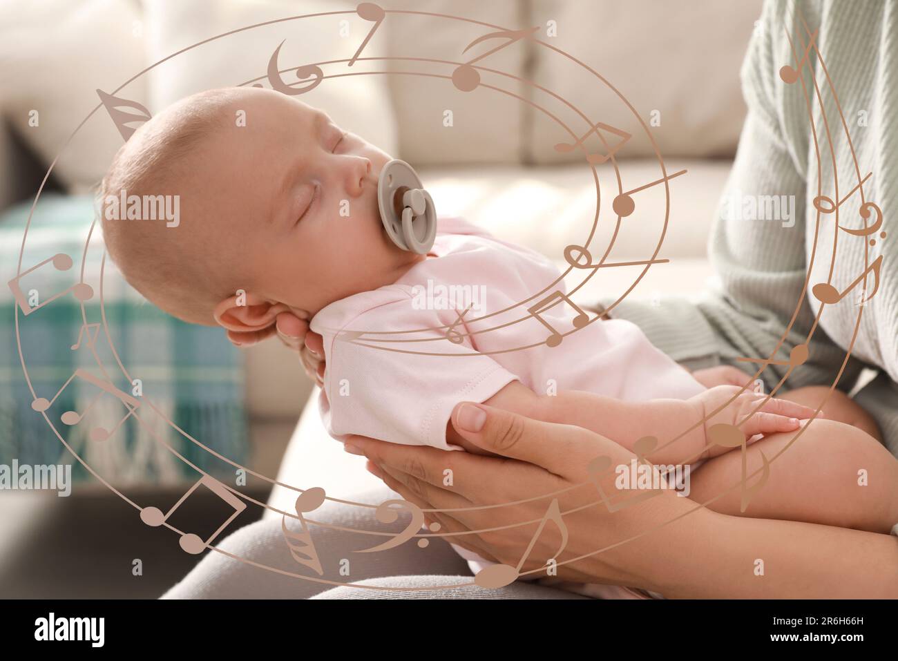 Mother singing lullaby to her sleepy baby at home, closeup. Music notes ...