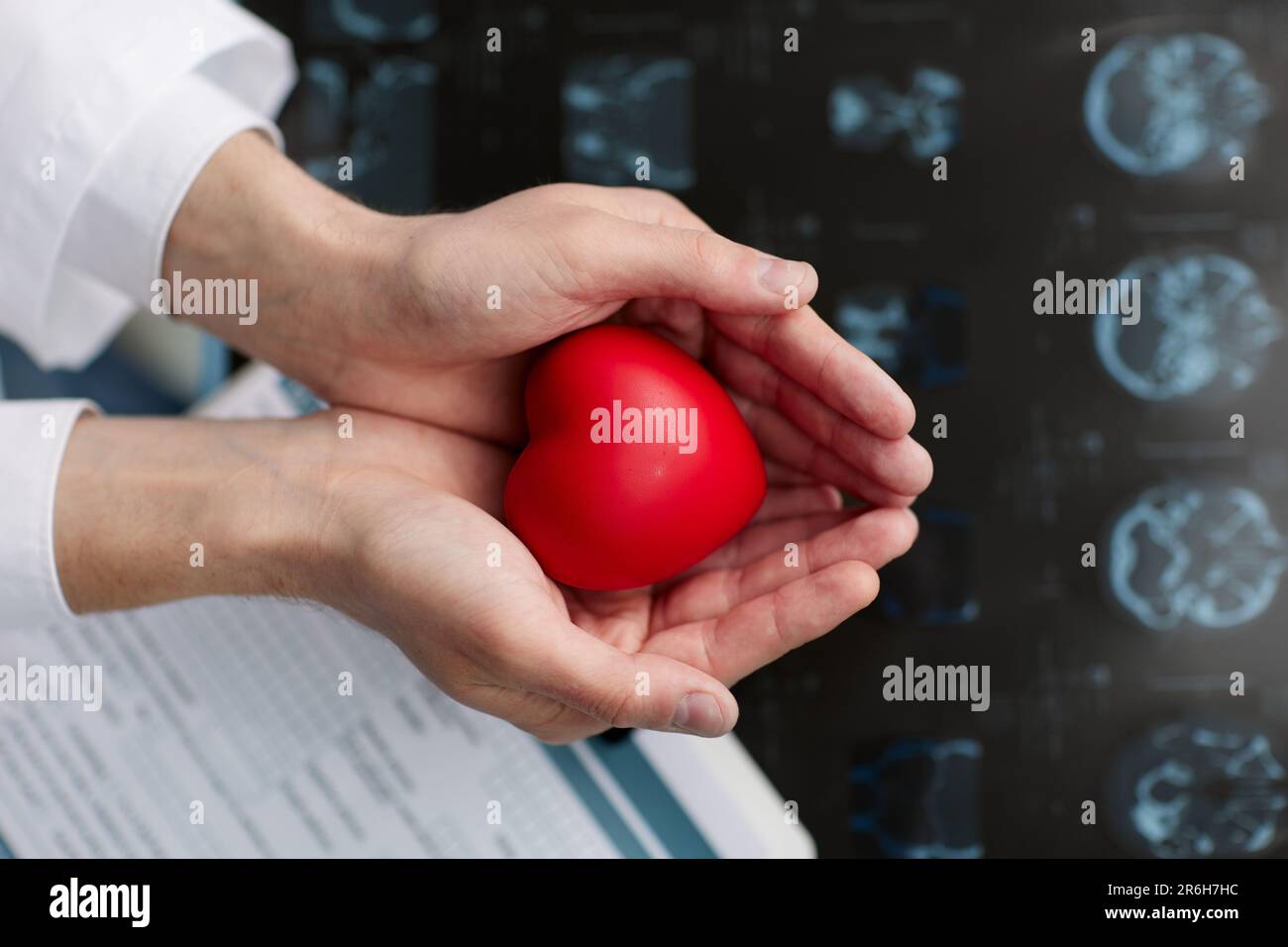 male hands with red hearts, top view. Cardiology concept Stock Photo ...