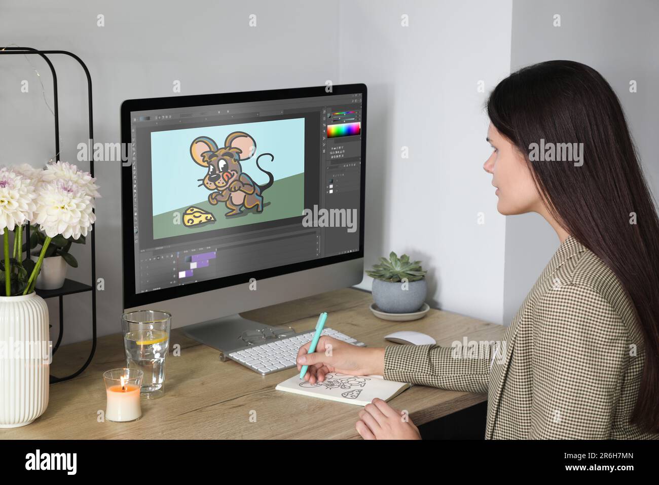 Animator working at table. Modern computer with illustration on screen ...