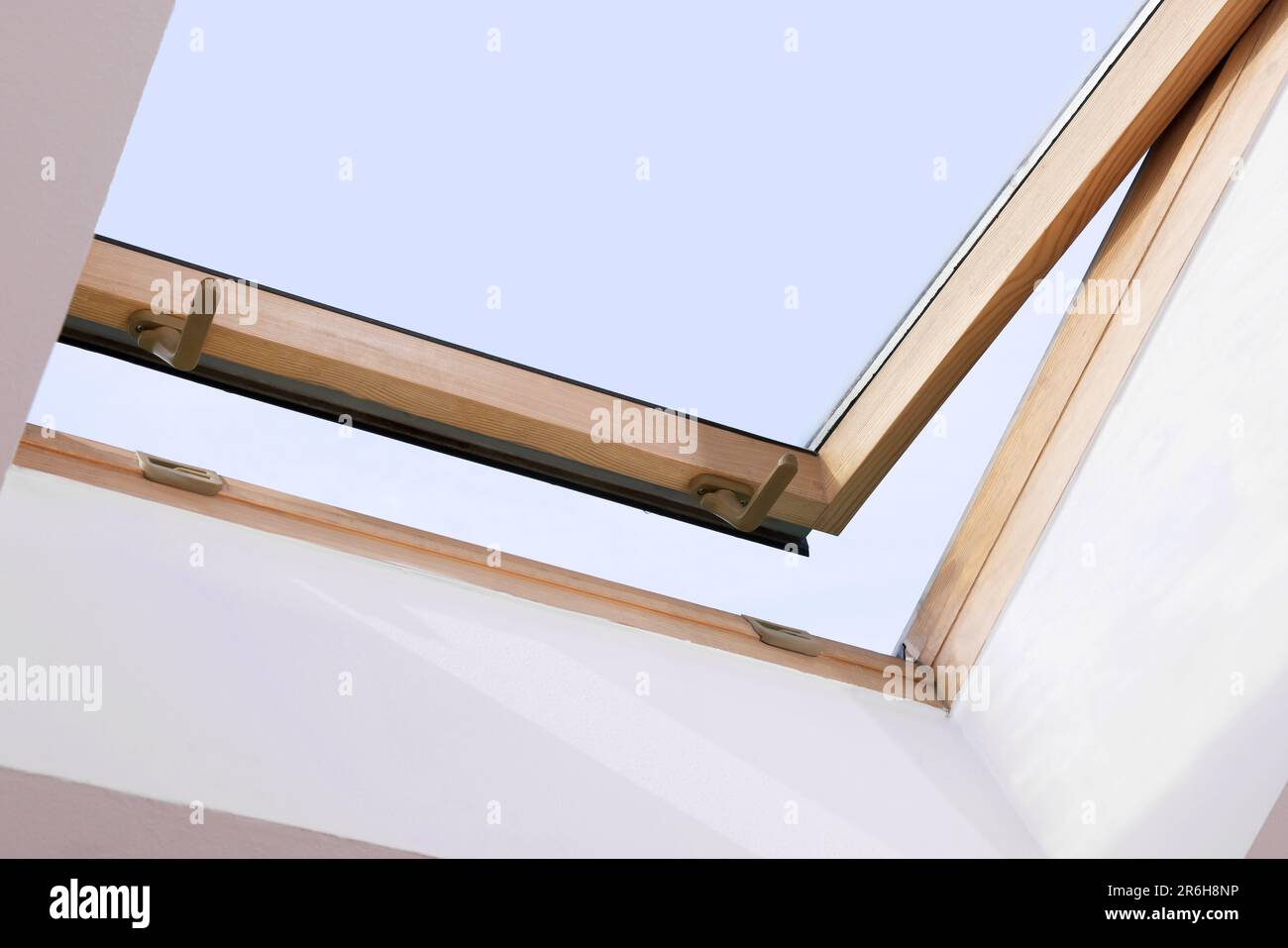 Open skylight roof window on slanted ceiling in attic room, low angle view Stock Photo - Alamy