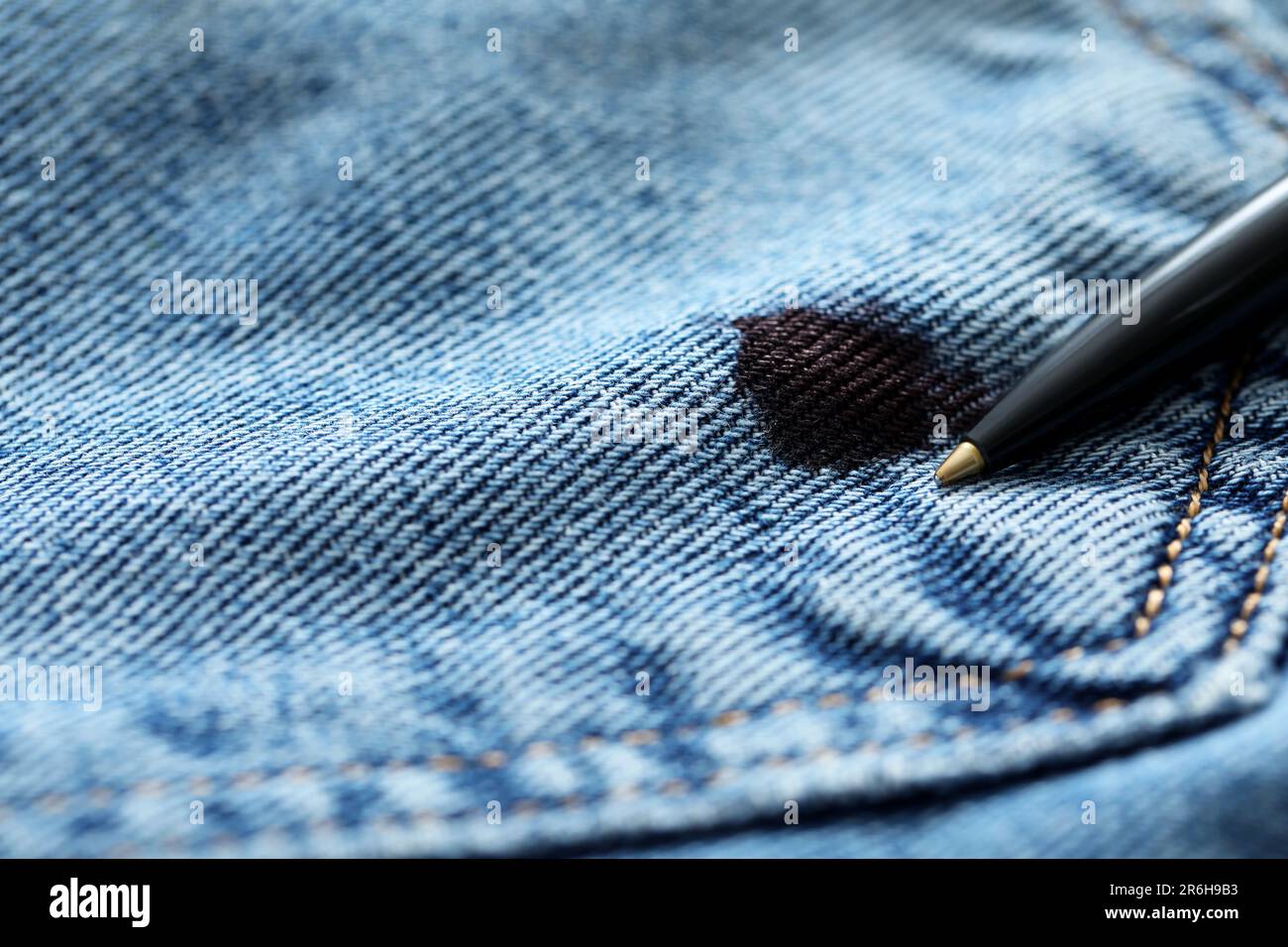 Pen and stain of black ink on jeans, closeup. Space for text Stock ...