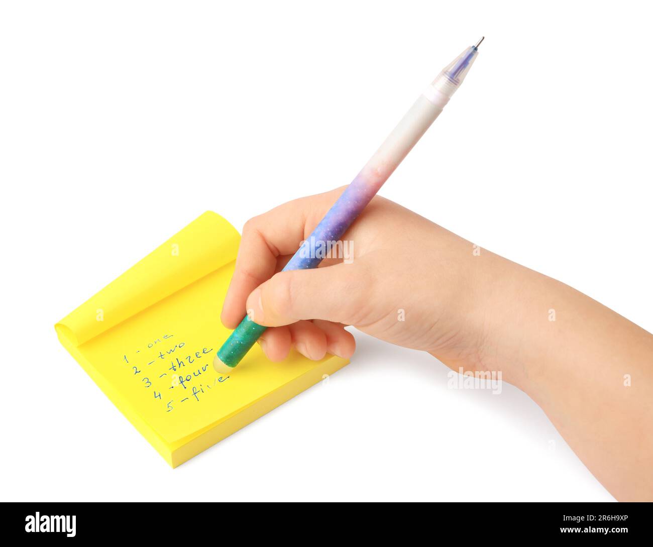 Child erasing word Five written with erasable pen on sticky note ...