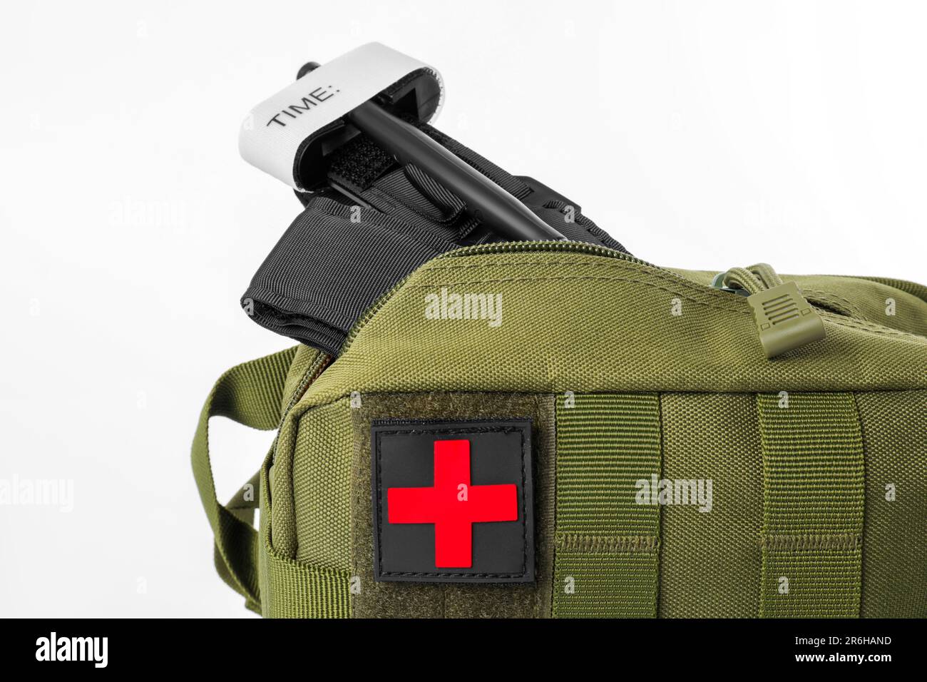 Military first aid kit and tourniquet isolated on white, closeup Stock ...