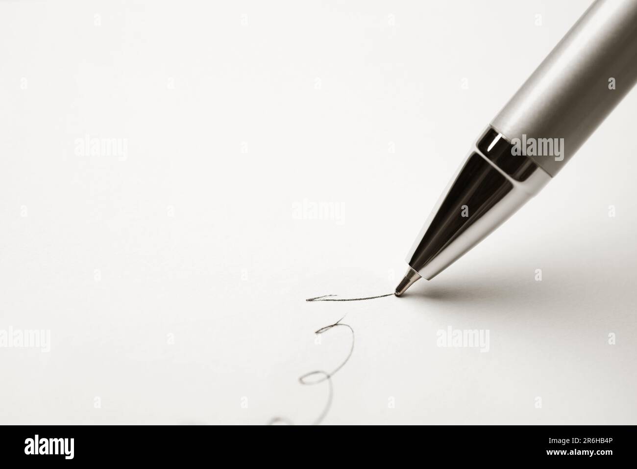 Signing on sheet of white paper with pen, closeup Stock Photo - Alamy