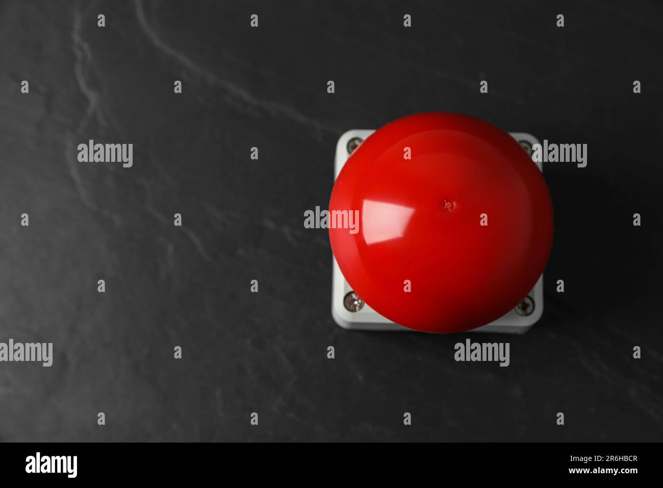 Red button of nuclear weapon on black background, top view with space ...