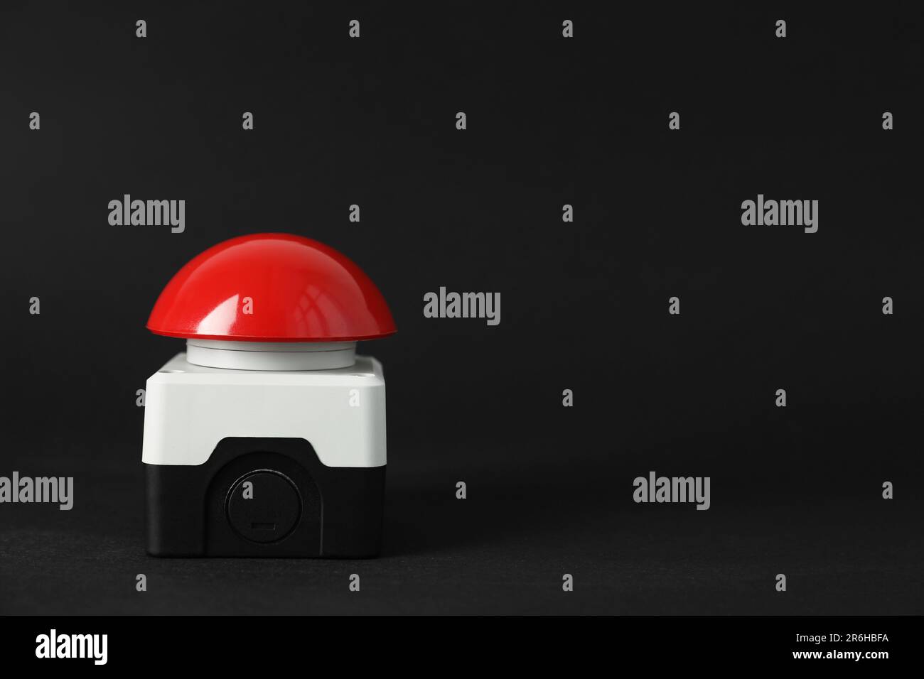 Red button of nuclear weapon on black background, space for text. War ...