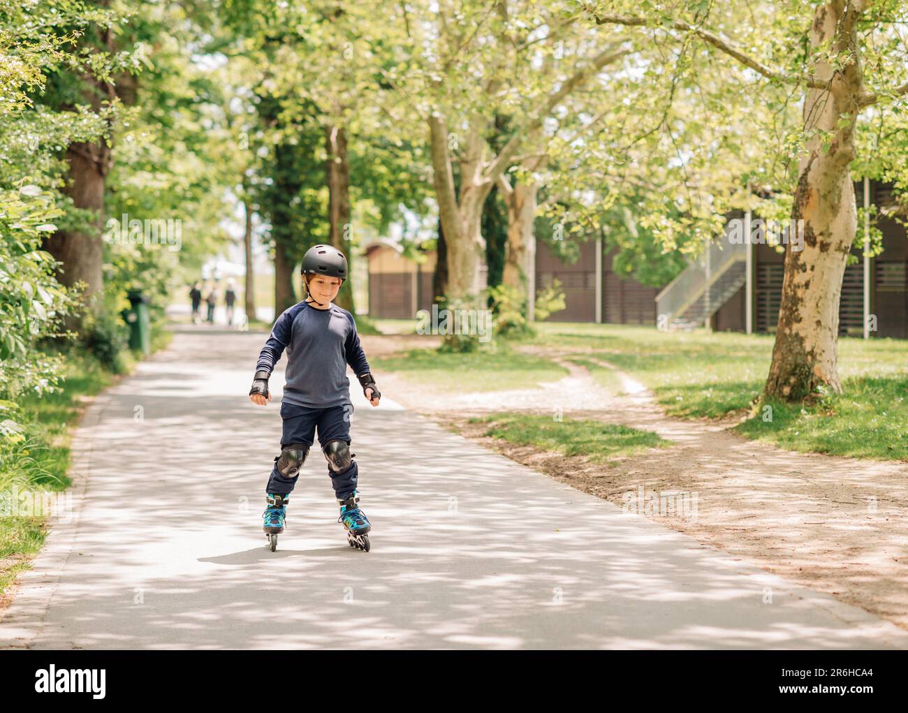 Active little boy skating in summer park, healthy lifestyle for ...