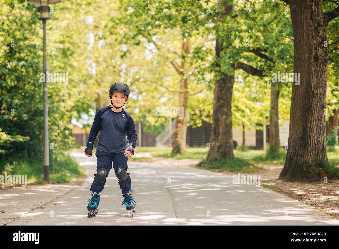 Active little boy skating in summer park, healthy lifestyle for ...